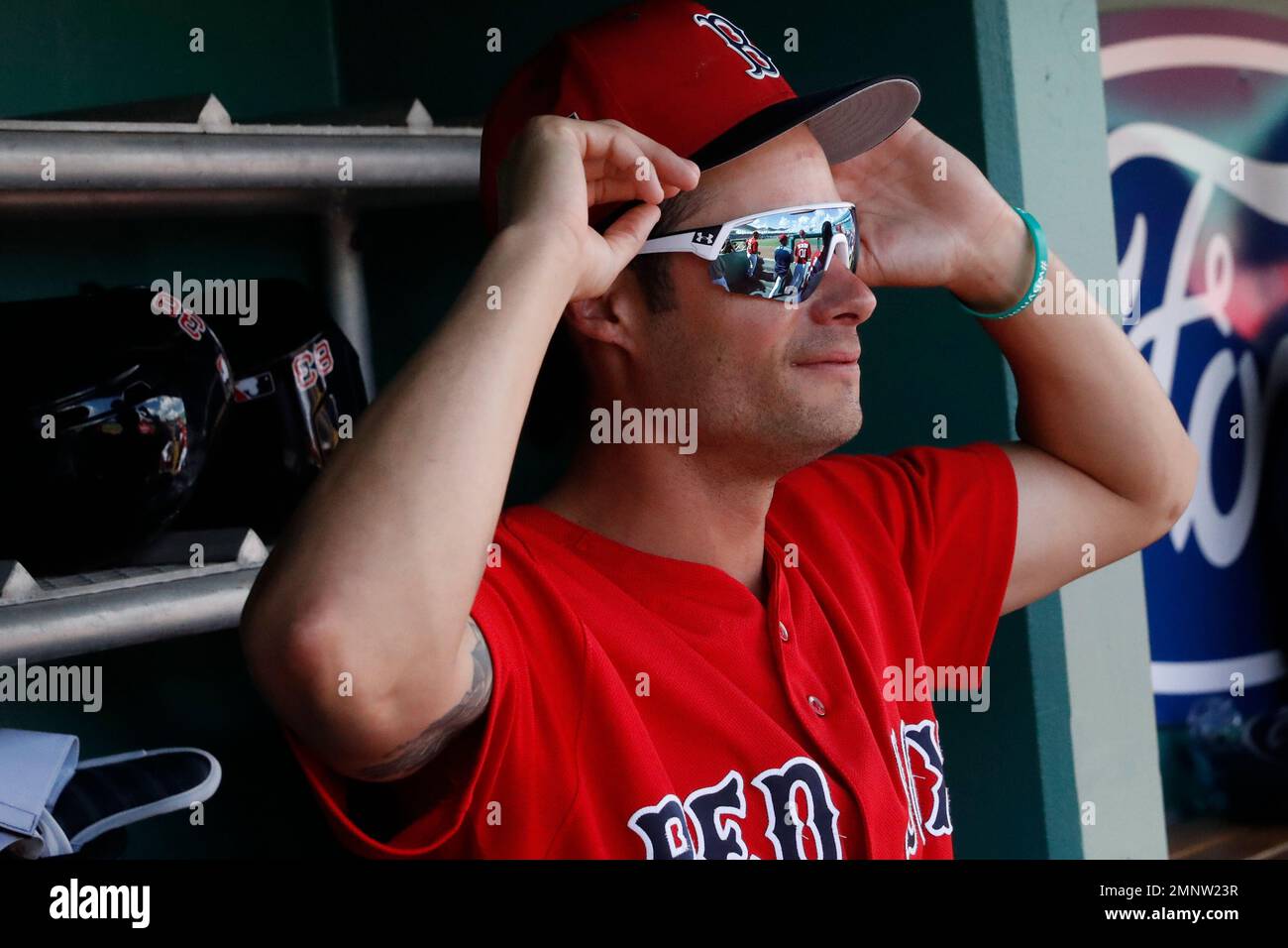 Boston Red Sox pitcher Joe Kelly stands in the dugout in the first ...