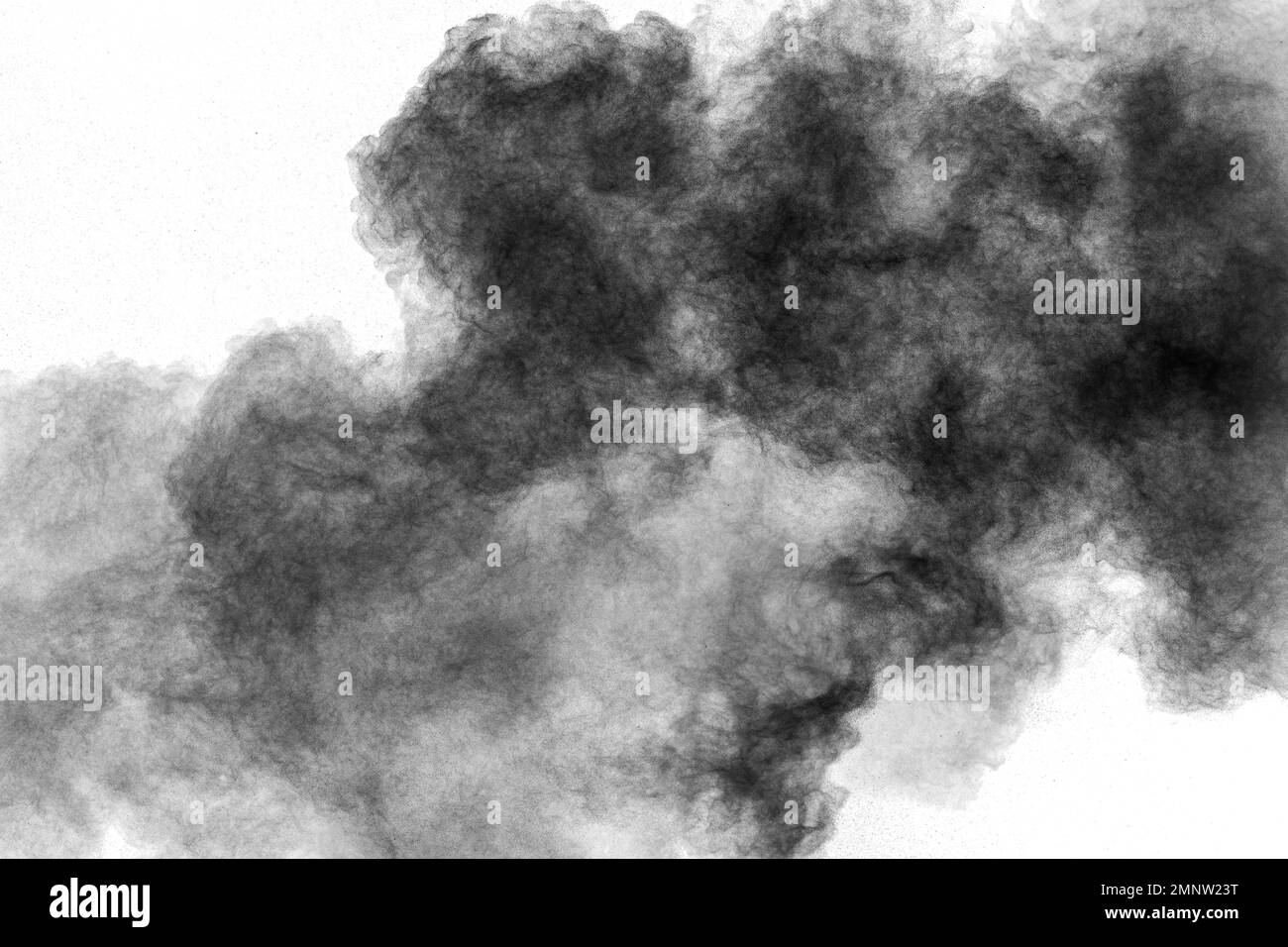 Black powder explosion against white background.Charcoal dust particles ...
