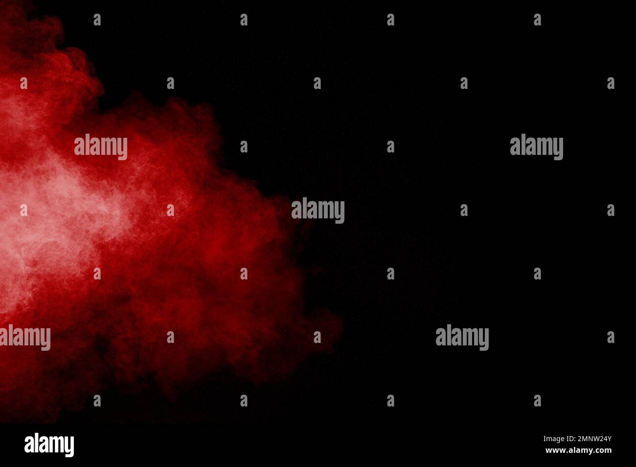 Red powder explosion cloud on black background. Freeze motion of red ...