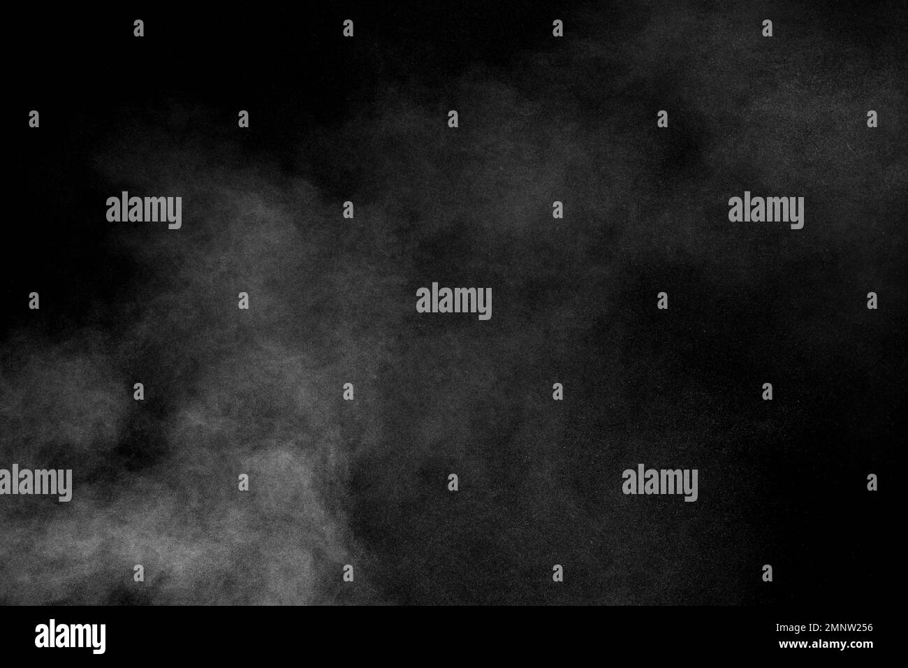 White dust cloud in the air.Abstract white powder explosion against ...