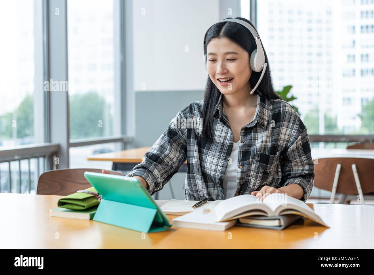 Young women use tablets Stock Photo - Alamy