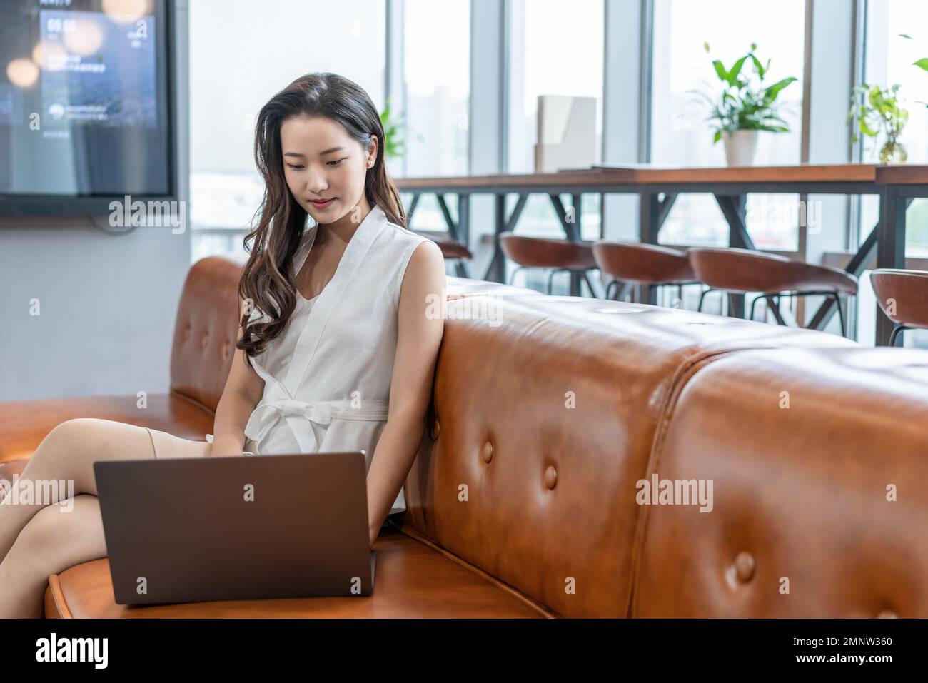 A young woman use the computer Stock Photo - Alamy