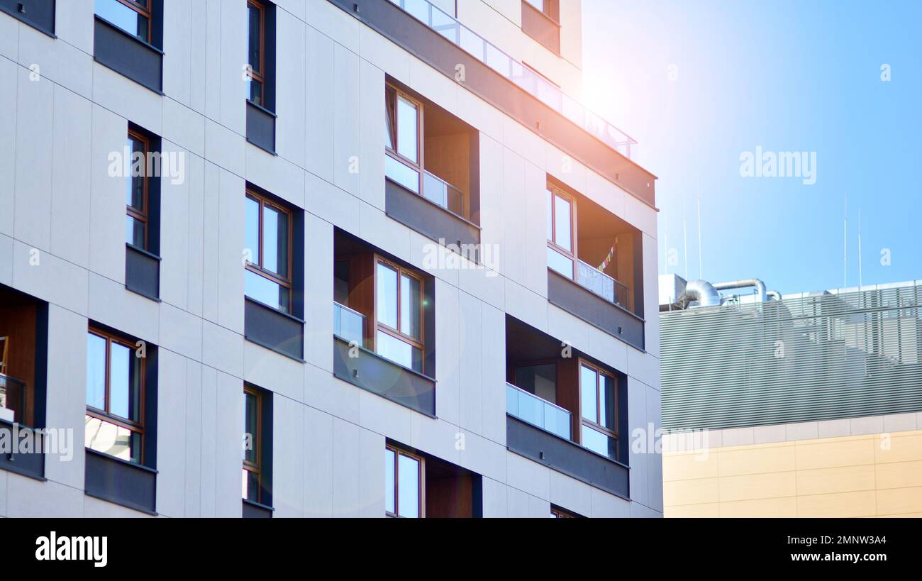 Futuristic square architecture of apartment building. Real estate with ...