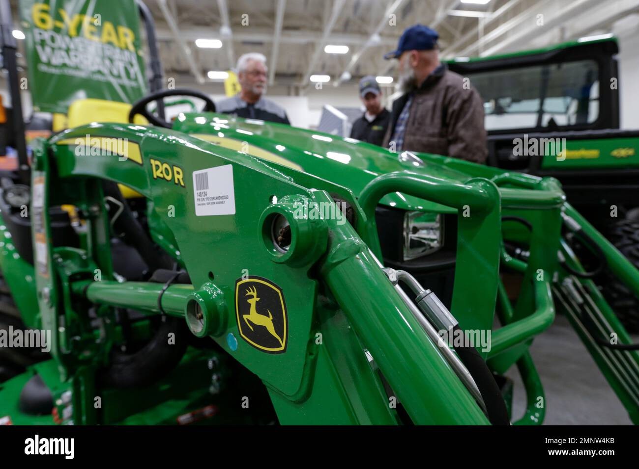 A John Deere tractor is on display at the "Spring into Spring" home and ...