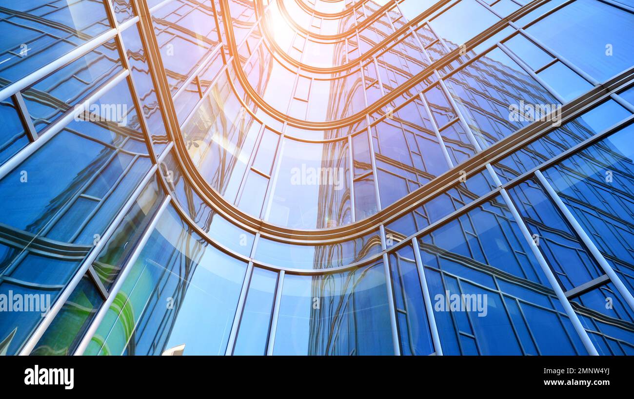 Abstract closeup of the glass-clad facade of a modern building covered ...
