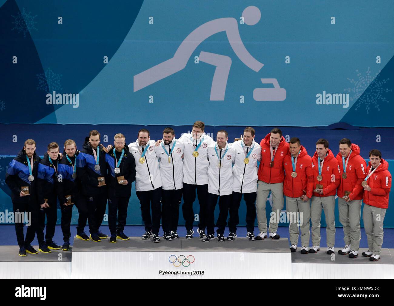Curling teams, from left, Sweden, silver medal, United States, Gold ...