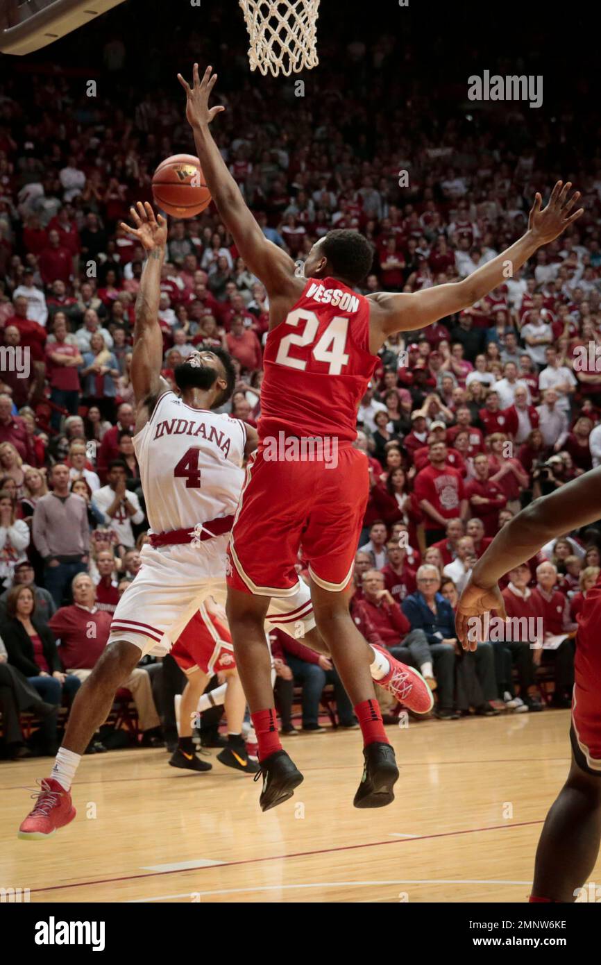 Indiana guard Robert Johnson (4) shoots in front of Ohio State forward ...