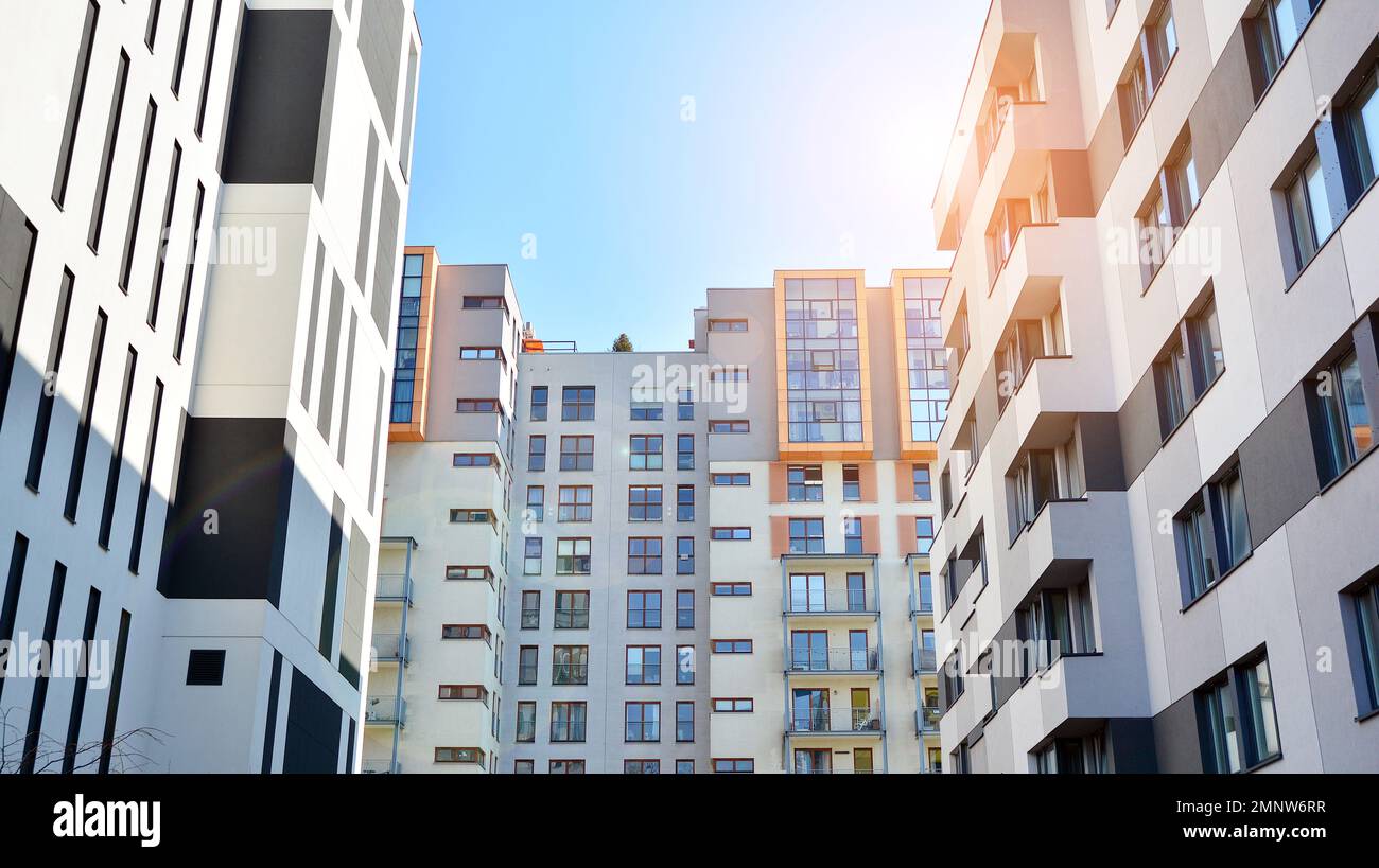 Futuristic square architecture of apartment building. Real estate with ...