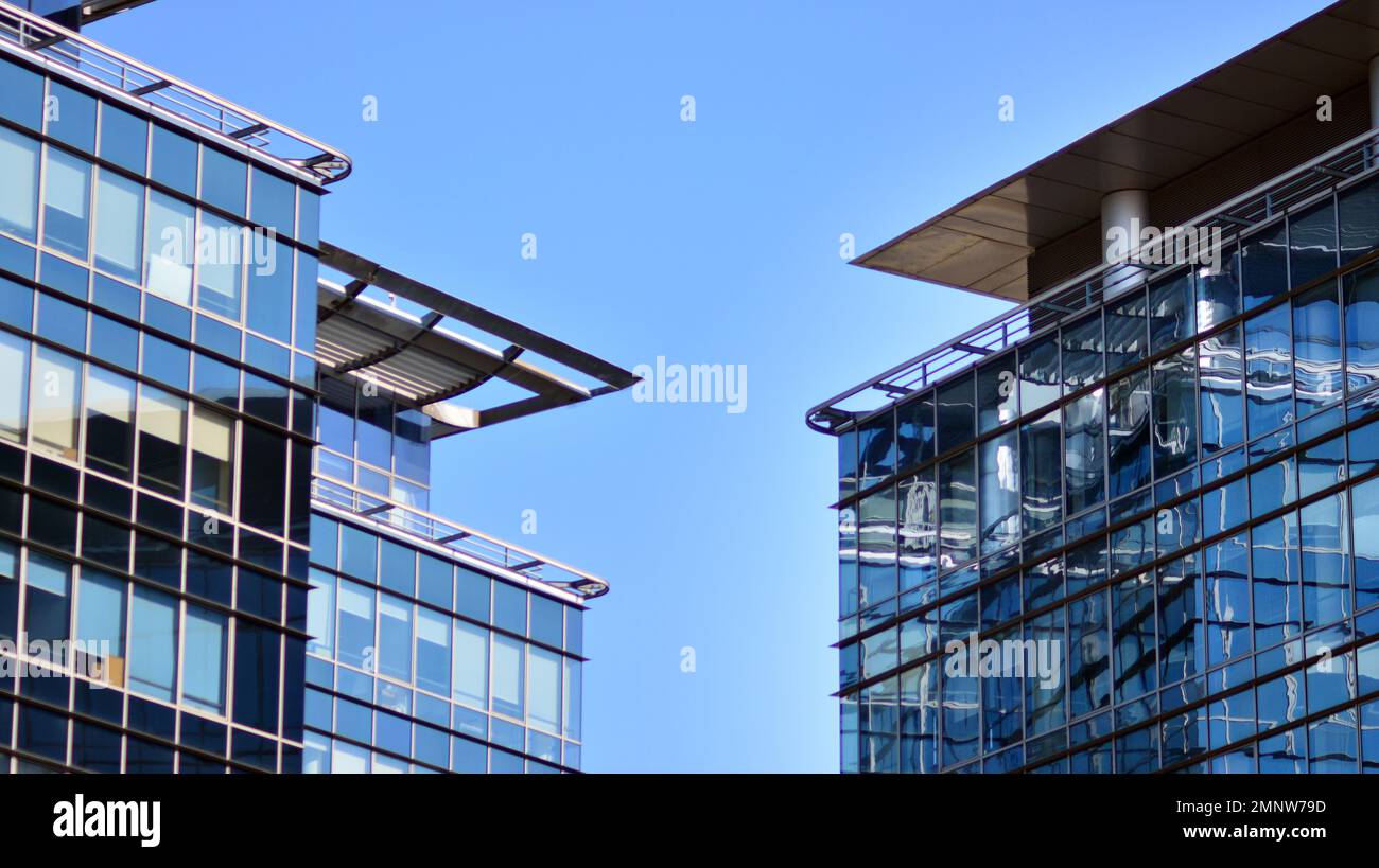 Abstract closeup of the glass-clad facade of a modern building covered ...