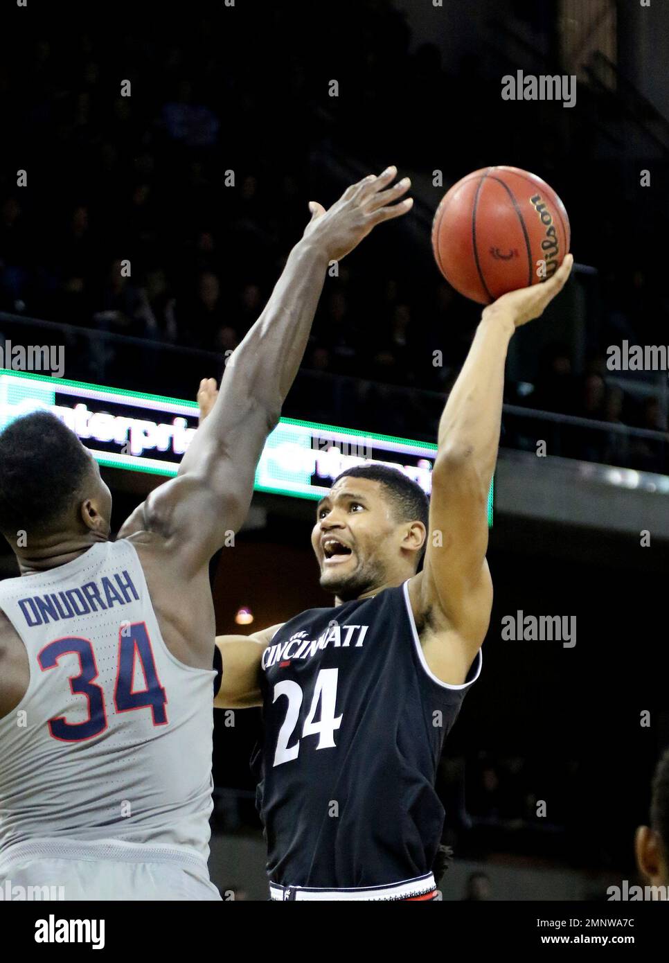 Cincinnati's Kyle Washington shoots over Connecticut's David Onurah ...