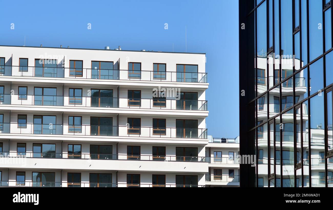 Futuristic square architecture of apartment building. Real estate with ...