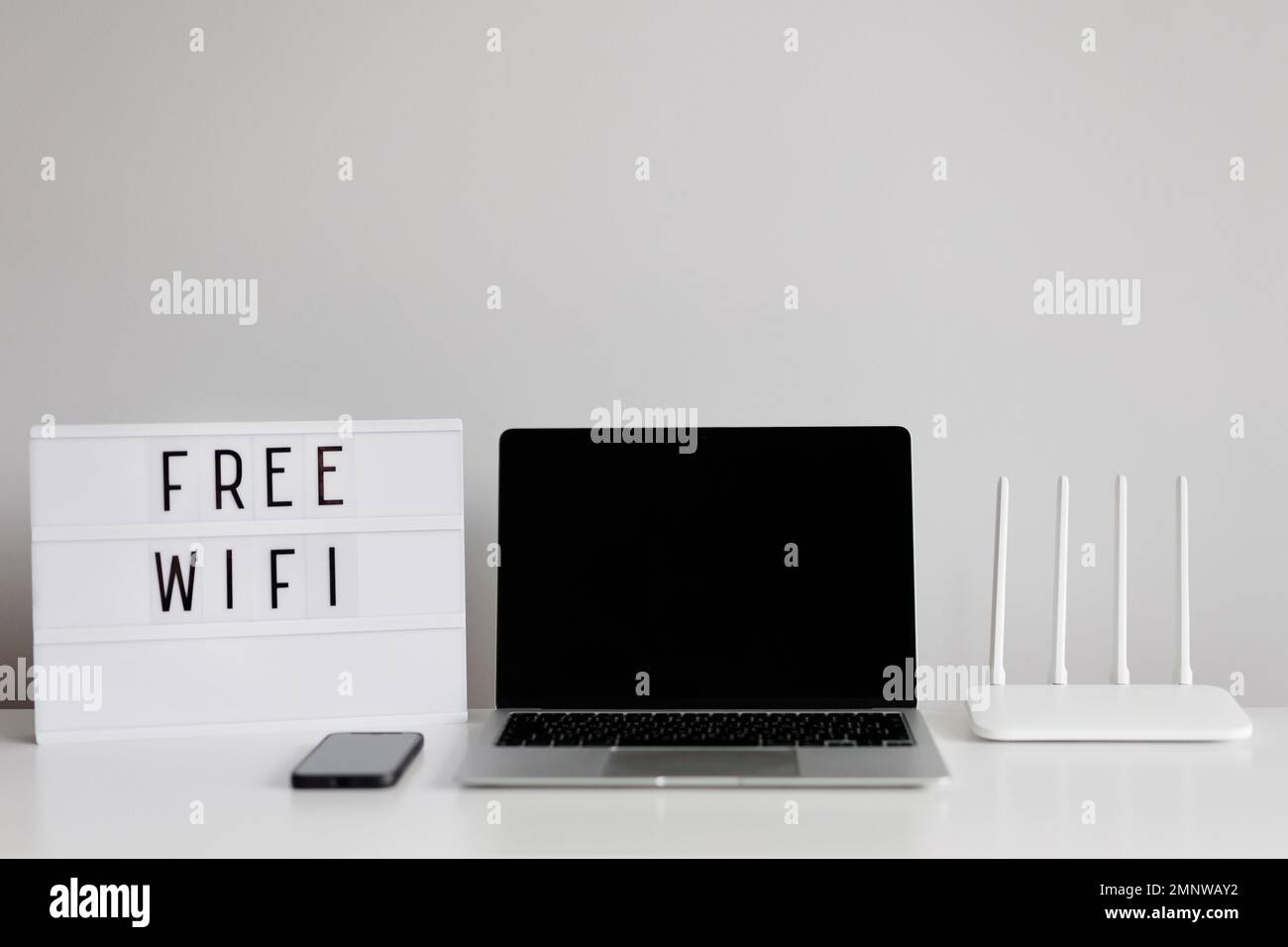 Modern Laptop Router Telephone And Lightbox With Free Wifi Text Stock