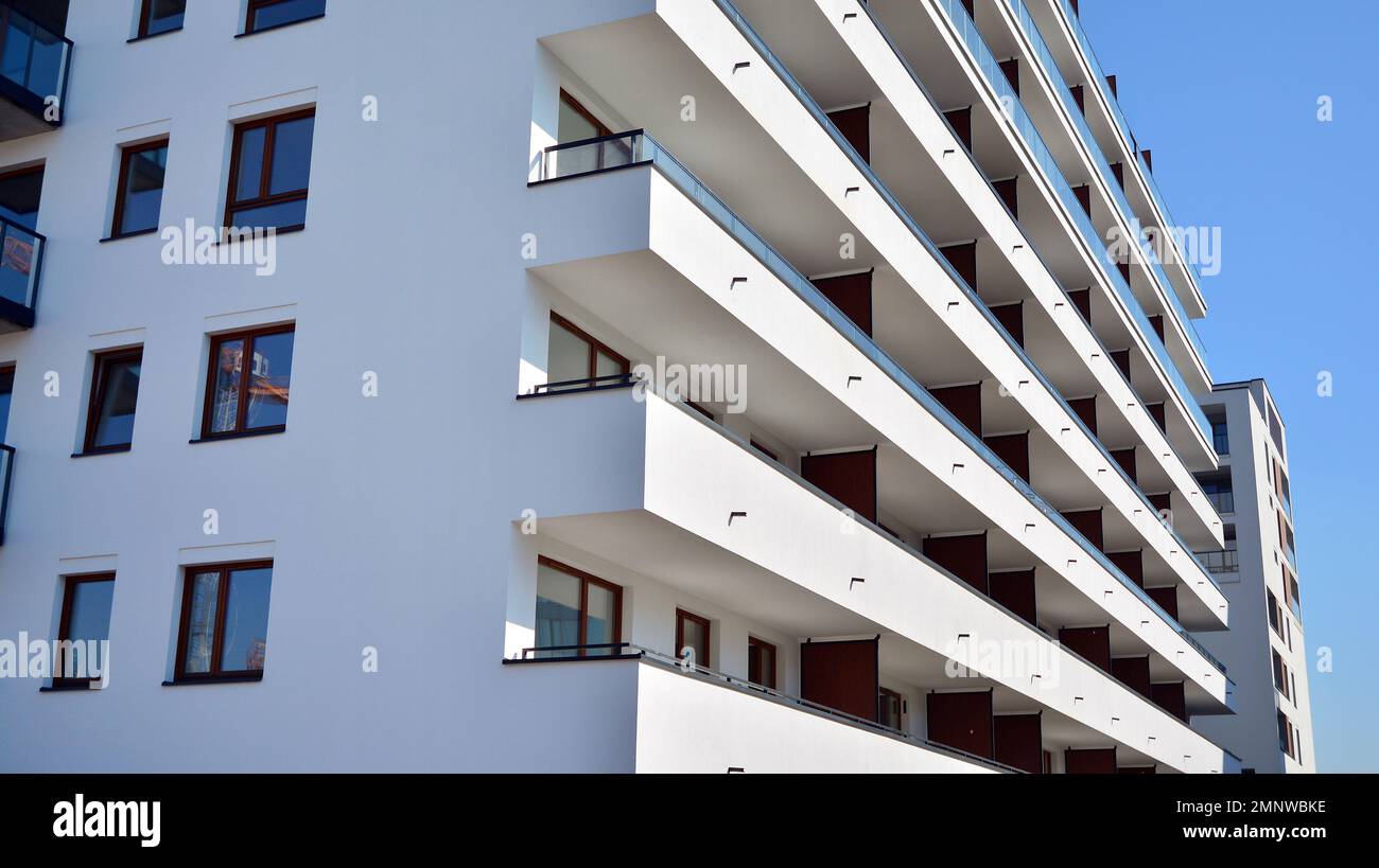 Futuristic square architecture of apartment building. Real estate with ...