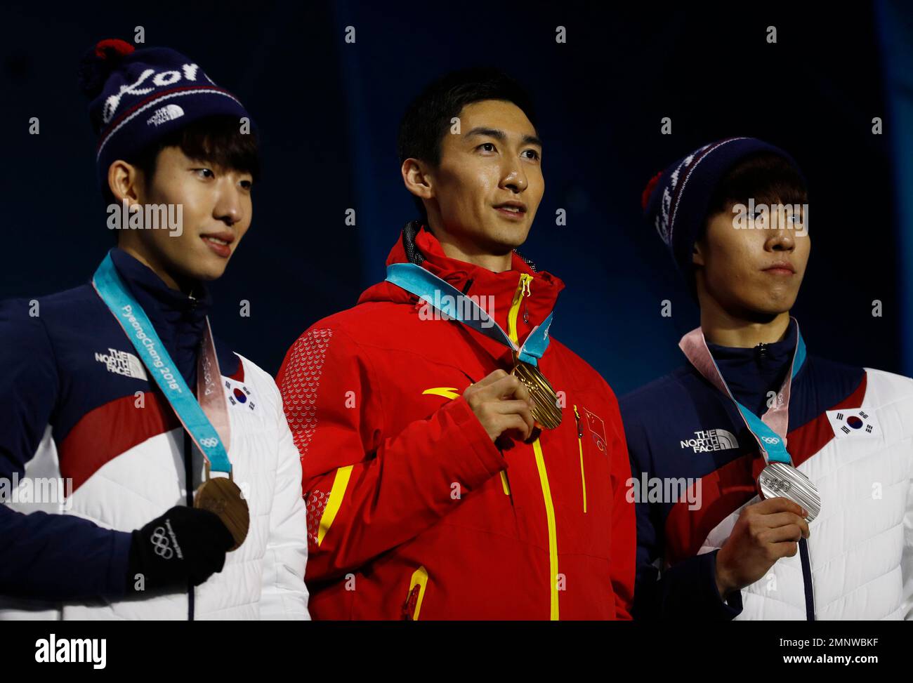 Medalists in the men's 500 meters short track speedskating, from right ...