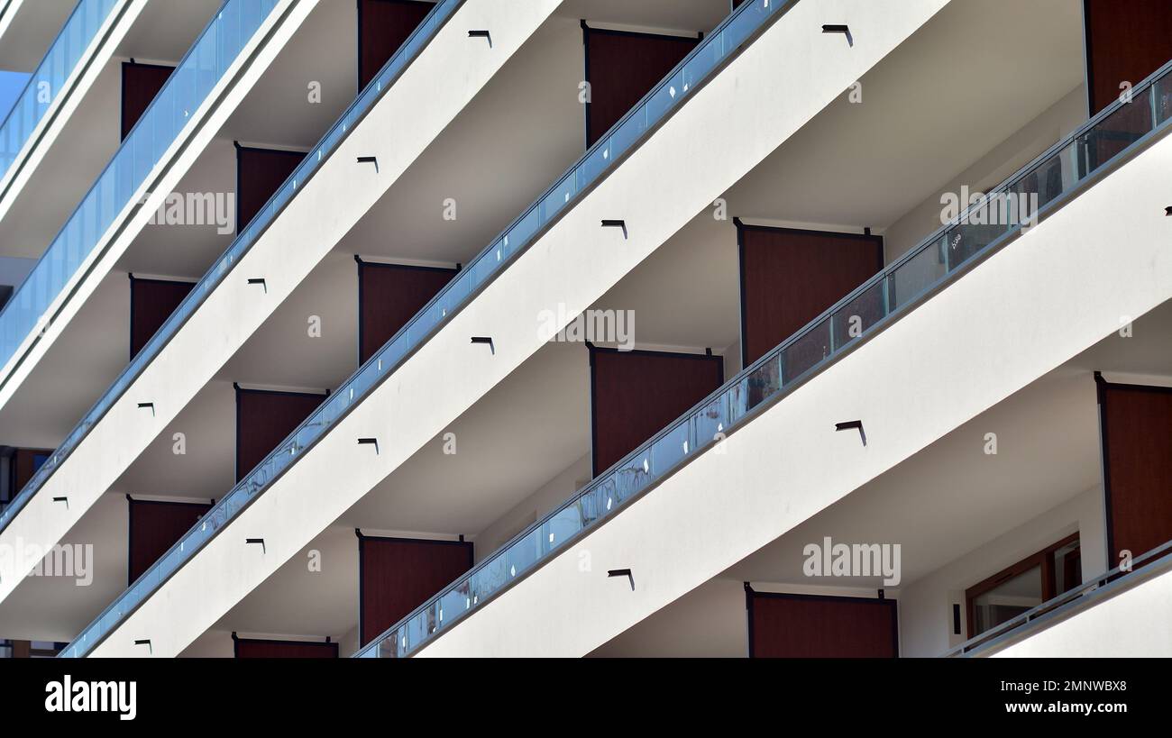 Futuristic square architecture of apartment building. Real estate with ...