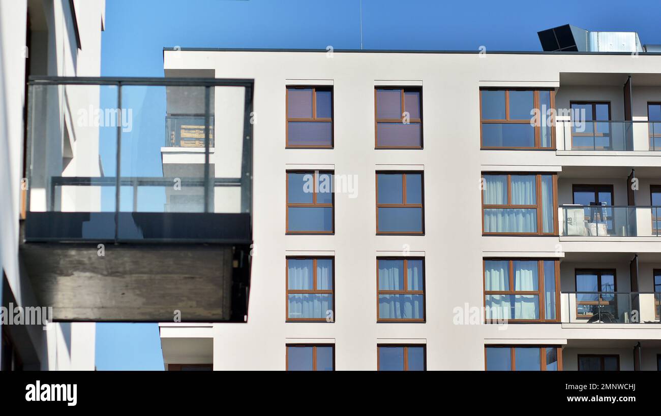 Futuristic square architecture of apartment building. Real estate with ...