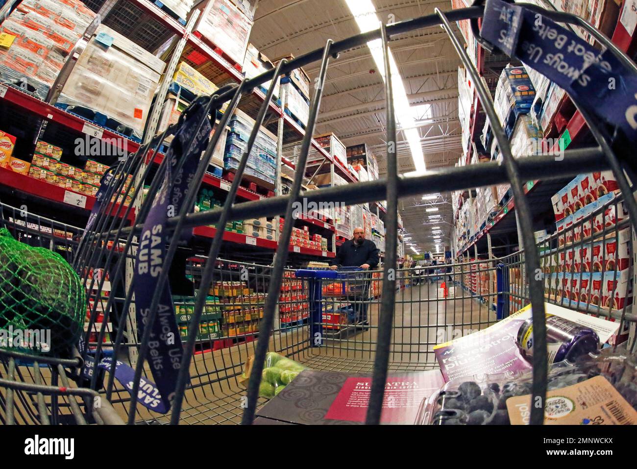 This Thursday, Feb. 22, 2018 photo shows a shopper walking down an ...