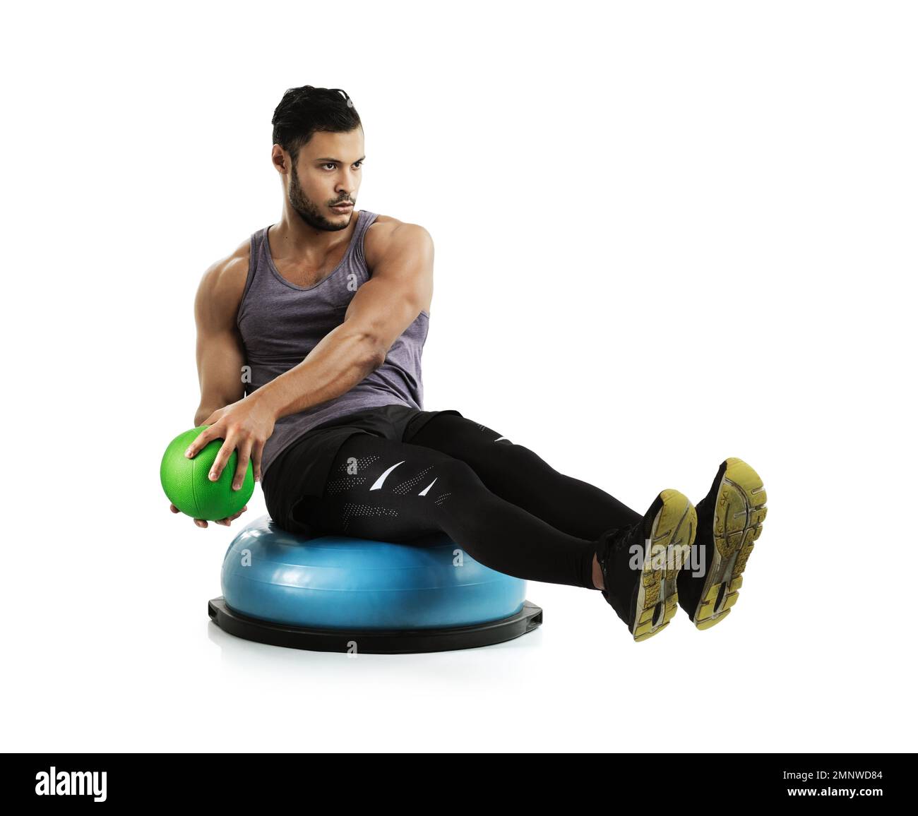 Working those core muscles to the max. Studio shot of a fit young man ...