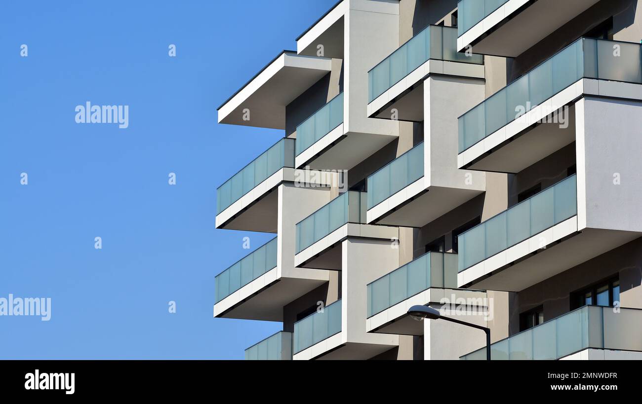 Futuristic square architecture of apartment building. Real estate with ...