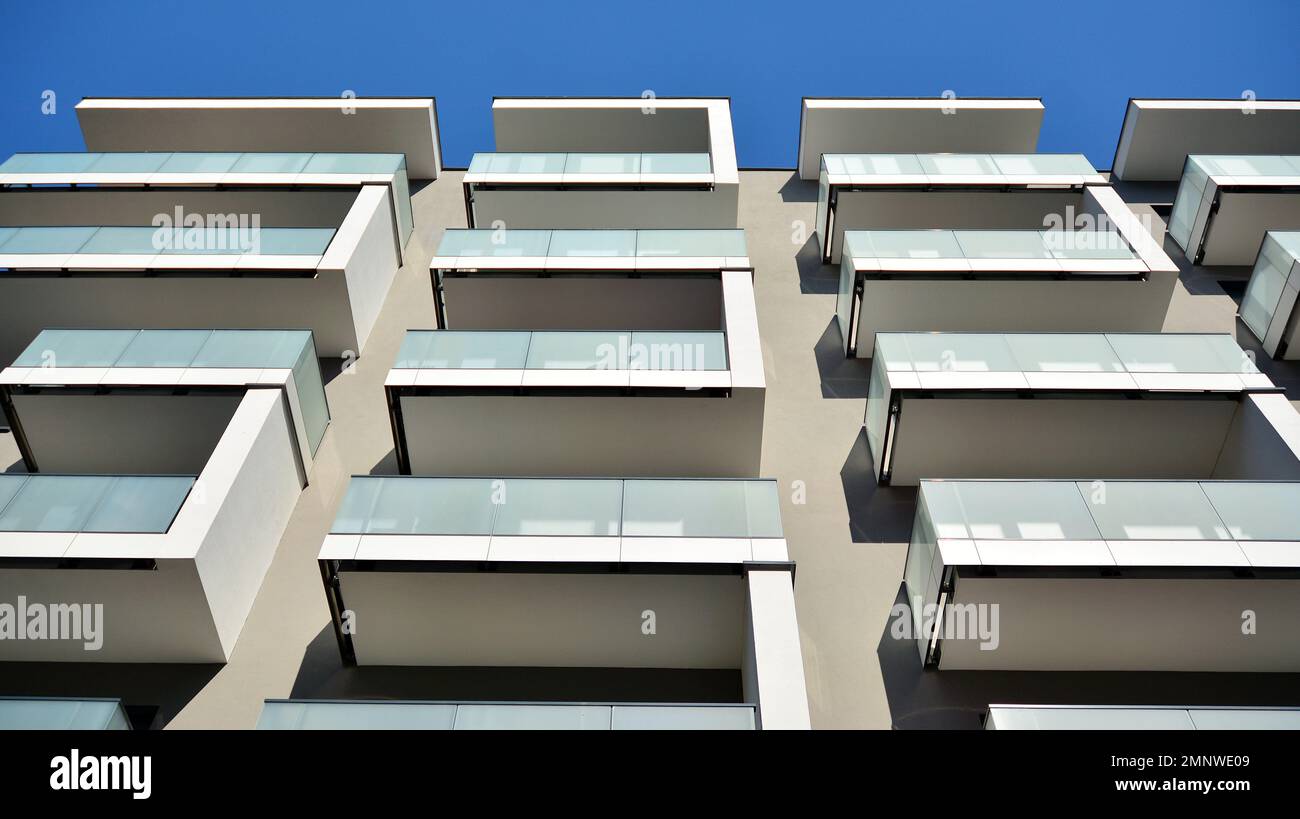 Futuristic square architecture of apartment building. Real estate with ...