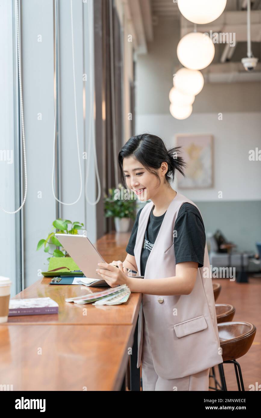 A young woman use the computer Stock Photo - Alamy