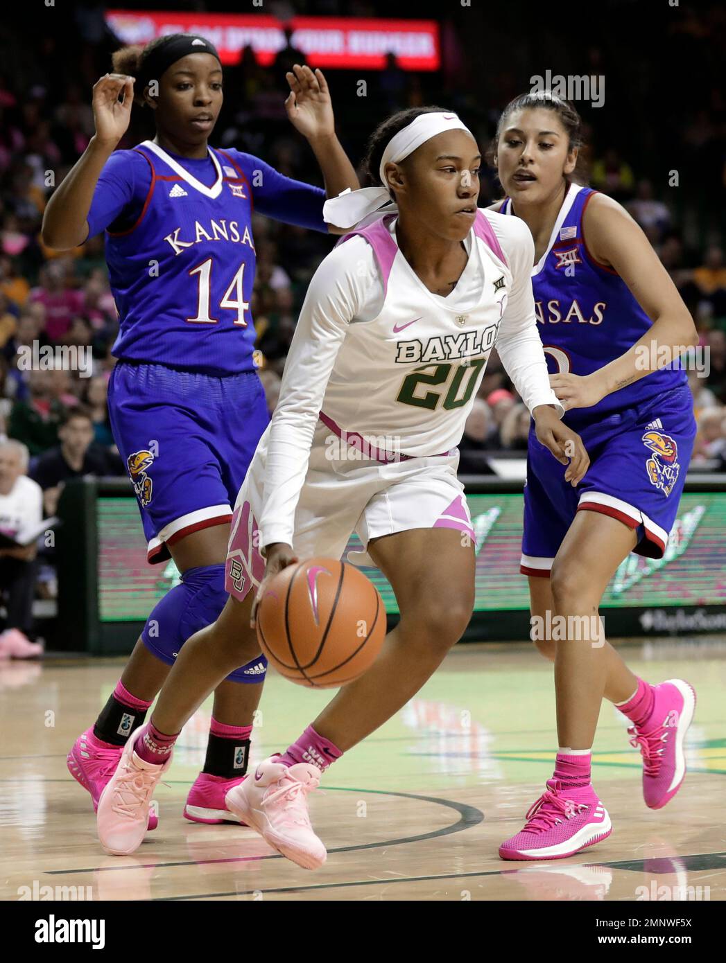Baylor's Juicy Landrum (20) handles the ball as Kansas' Austin ...