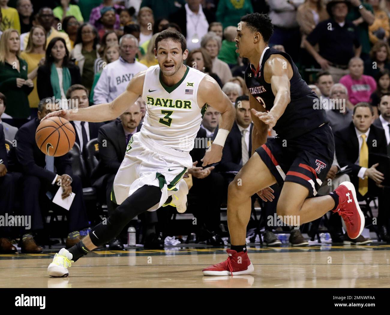 Baylor's Jake Lindsey (3) drives up court as Texas Tech guard Zhaire ...