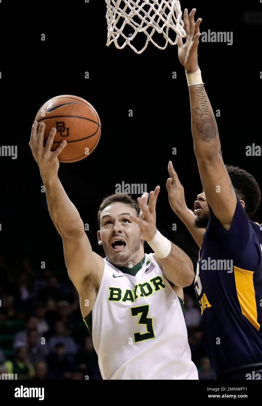 Baylor guard Jake Lindsey (3) goes up for a shot as West Virginia's Esa ...