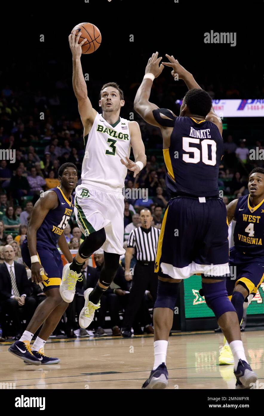 Baylor guard Jake Lindsey (3) goes up for a shot as West Virginia ...
