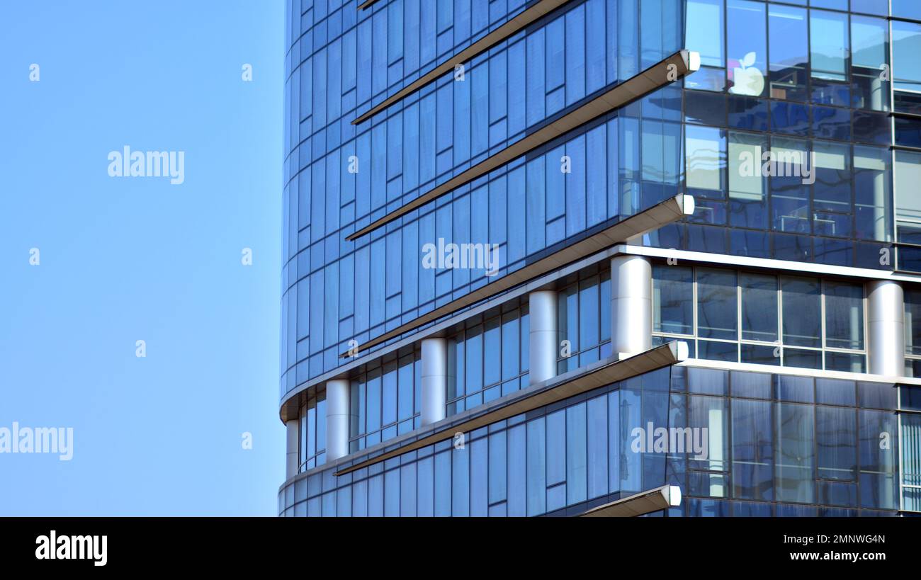 Abstract closeup of the glass-clad facade of a modern building covered ...