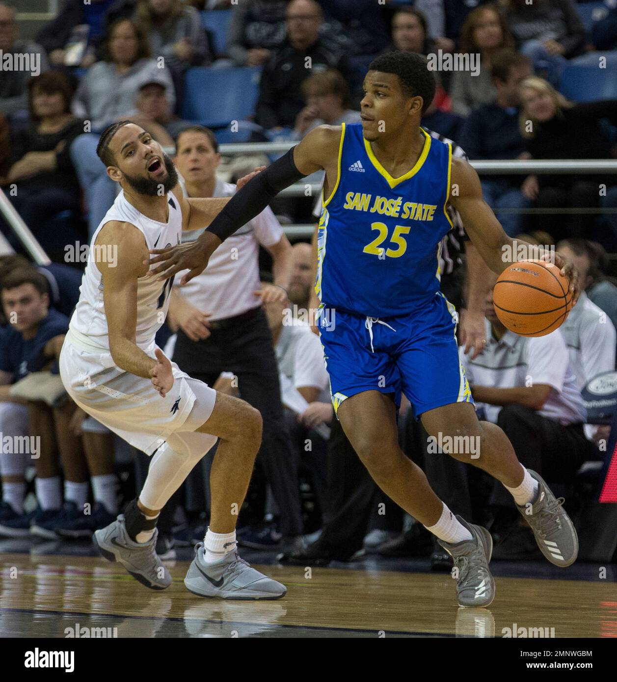 San Jose State's Jaycee Hillsman dribbles around Nevada's Caleb Martin ...