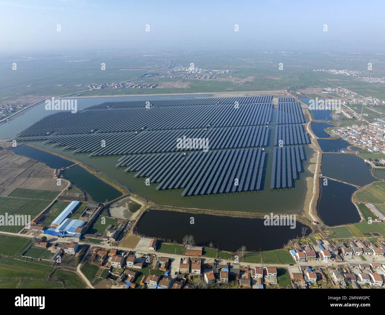 Aerial photo shows rows of photovoltaic panels floating on water in ...