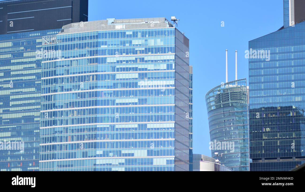 Abstract closeup of the glass-clad facade of a modern building covered ...