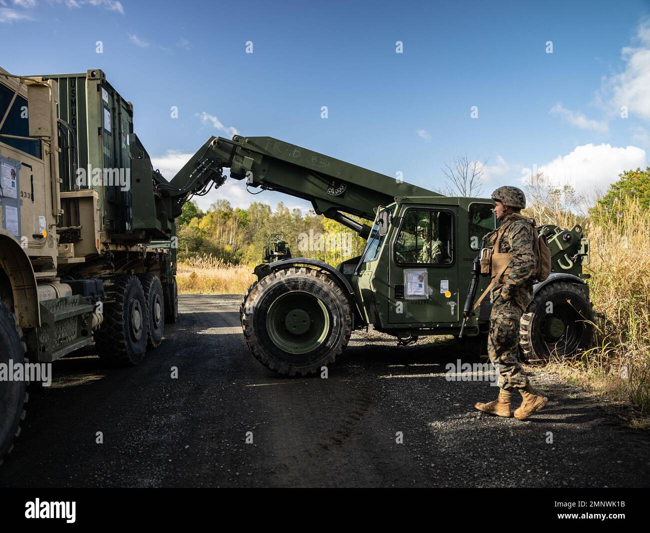 U.S. Marine Corps Lance Cpl. Joseph James, a heavy equipment operator ...