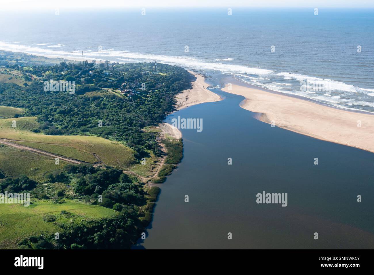 Flying aerial view overlooking Tugela river mouth lagoon beach entrance ...