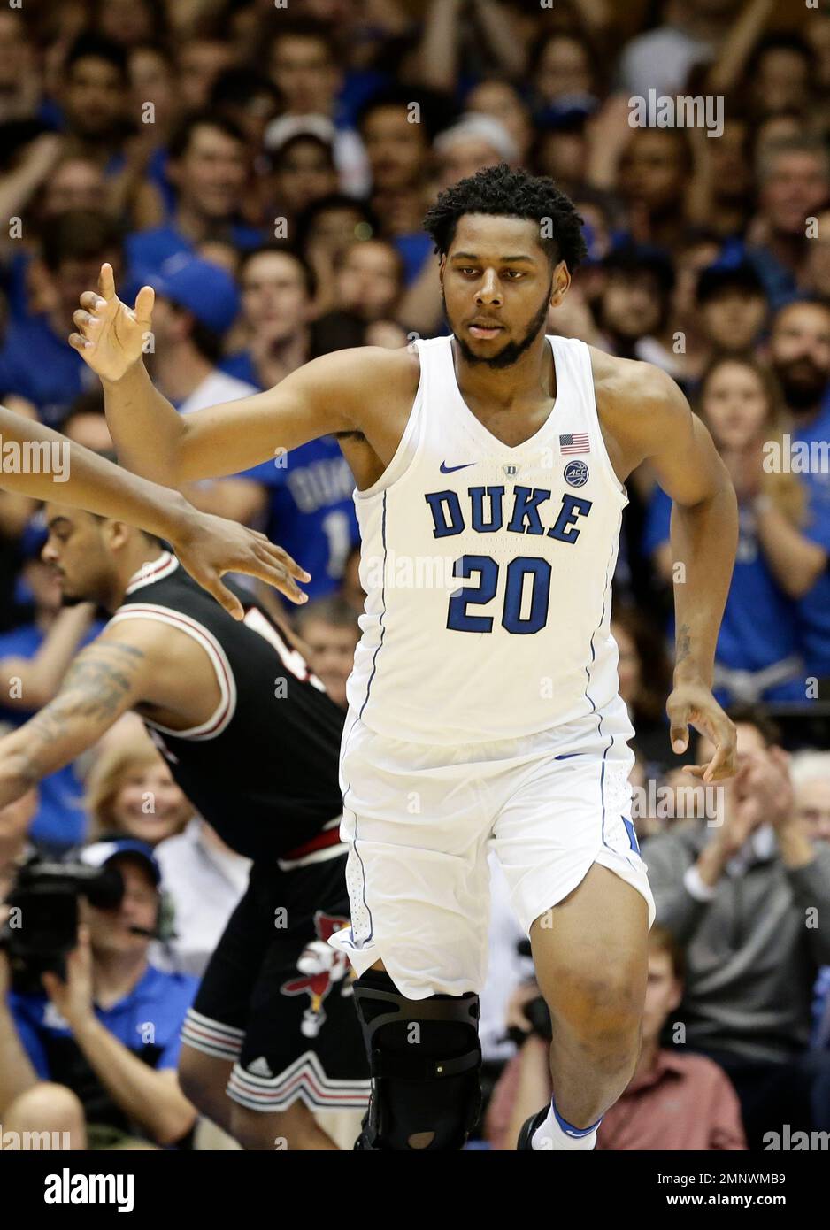 Duke's Marques Bolden (20) is congratulated following a basket against ...