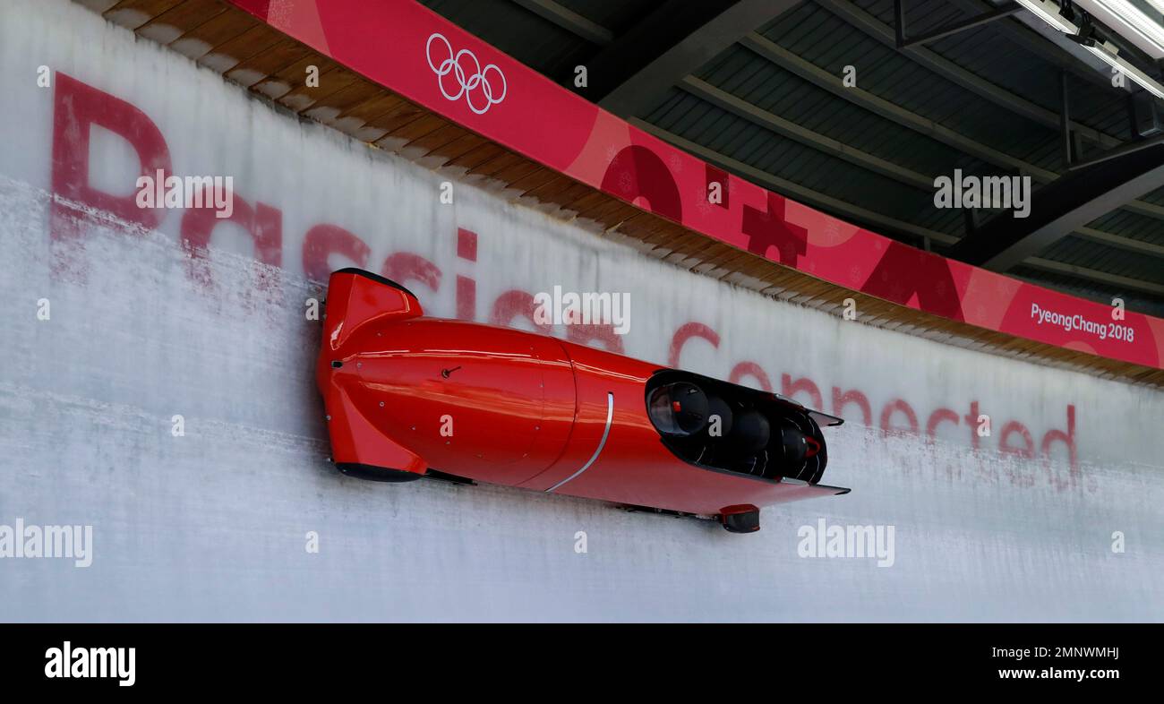 Driver Shao Yijun, Shi Hao, Li Chunjian and Wang Sidong of China take a curve during training ...