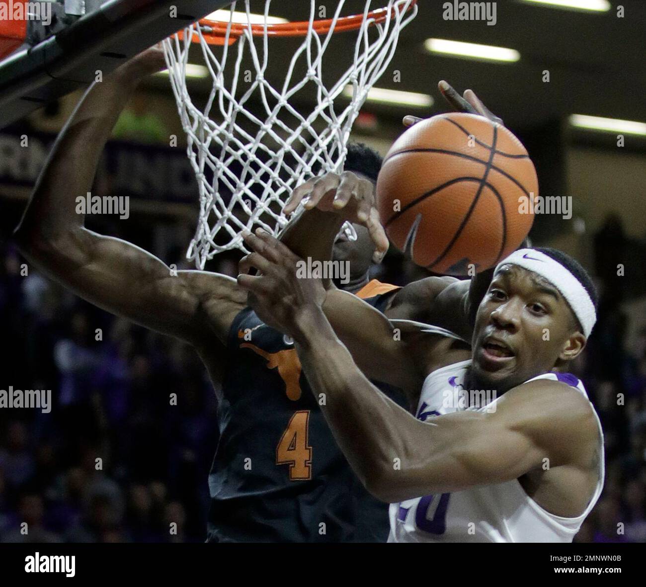 Kansas State forward Xavier Sneed (20) rebounds against Texas forward ...