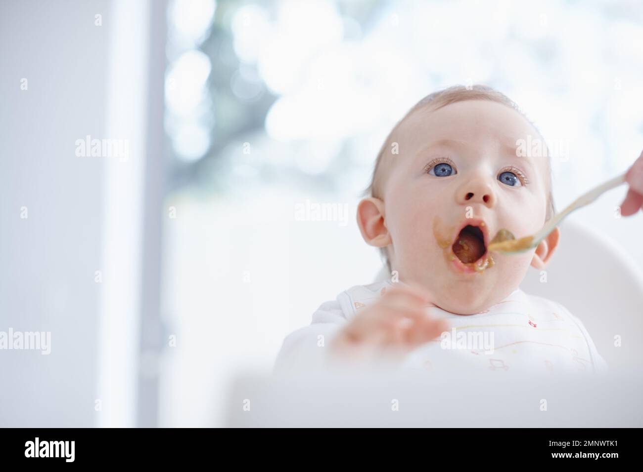 Say aaaah....Cropped image of a baby boy opening his mouth for his ...
