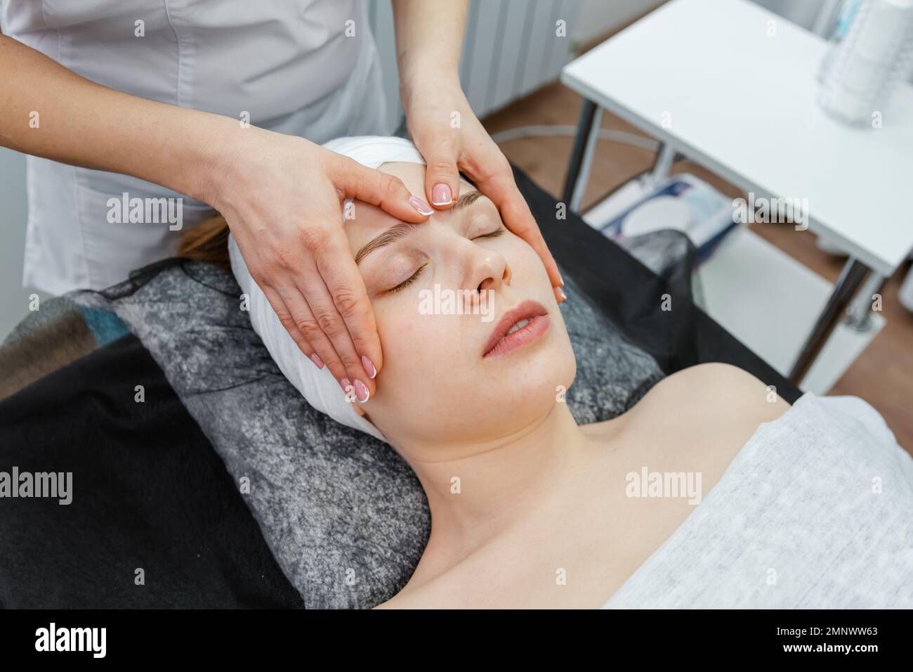 Woman under facial spa procedure hi-res stock photography and images ...