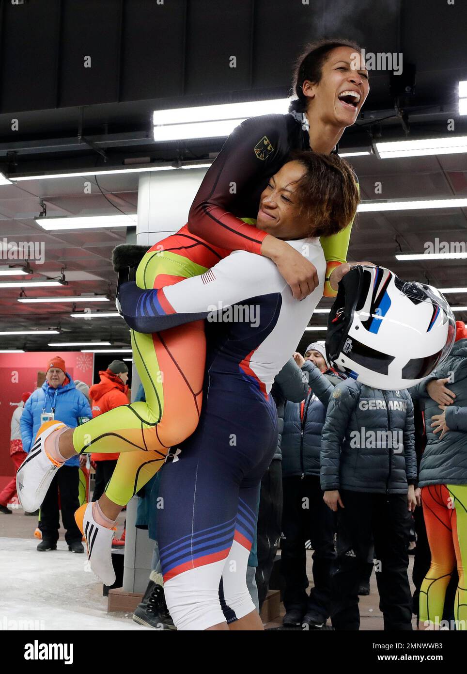 Gold medalist Mariama Jamanka of Germany gets lifted by silver medal winner Lauren Gibbs of the ...
