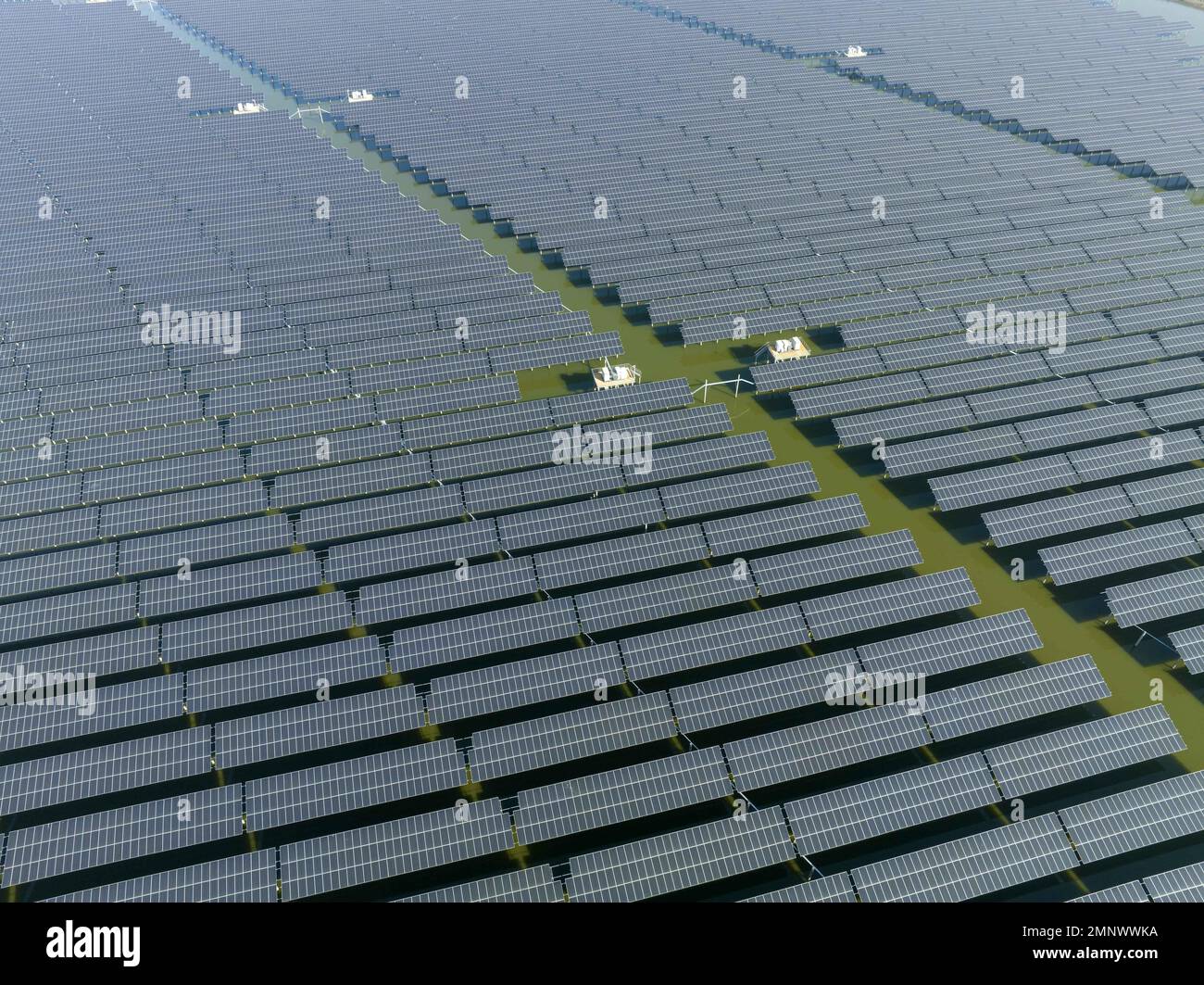 Aerial photo shows rows of photovoltaic panels floating on water in ...