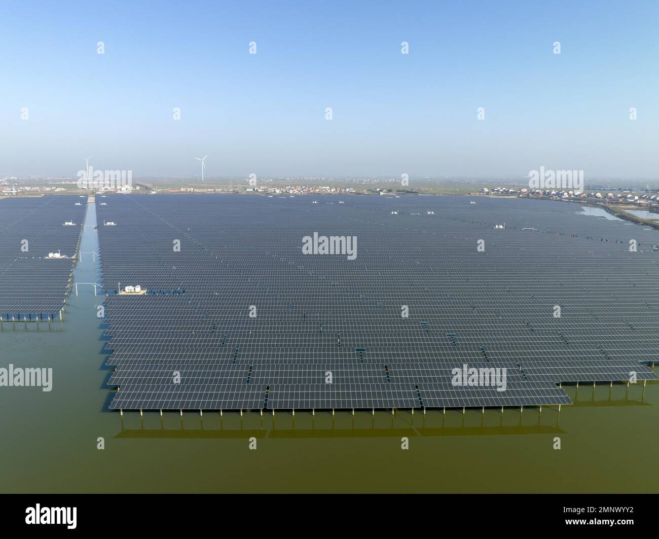 Aerial photo shows rows of photovoltaic panels floating on water in ...