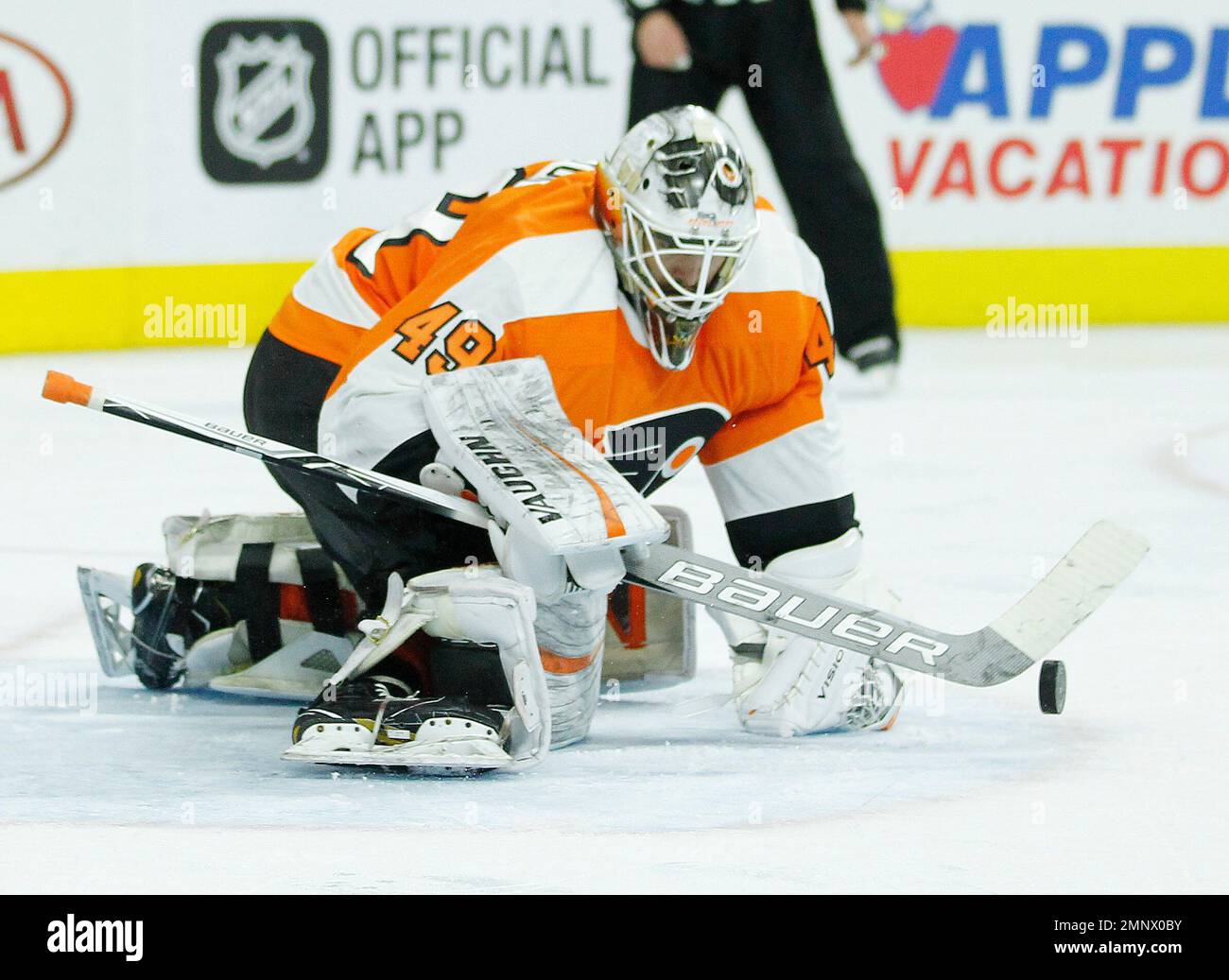 Philadelphia Flyers' Alex Lyon deflects a shot on goal during the ...