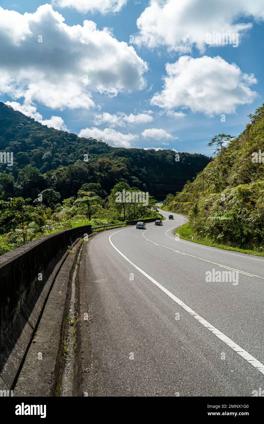 Car crosses mountain road winding. Curved asphalt road in mountain ...