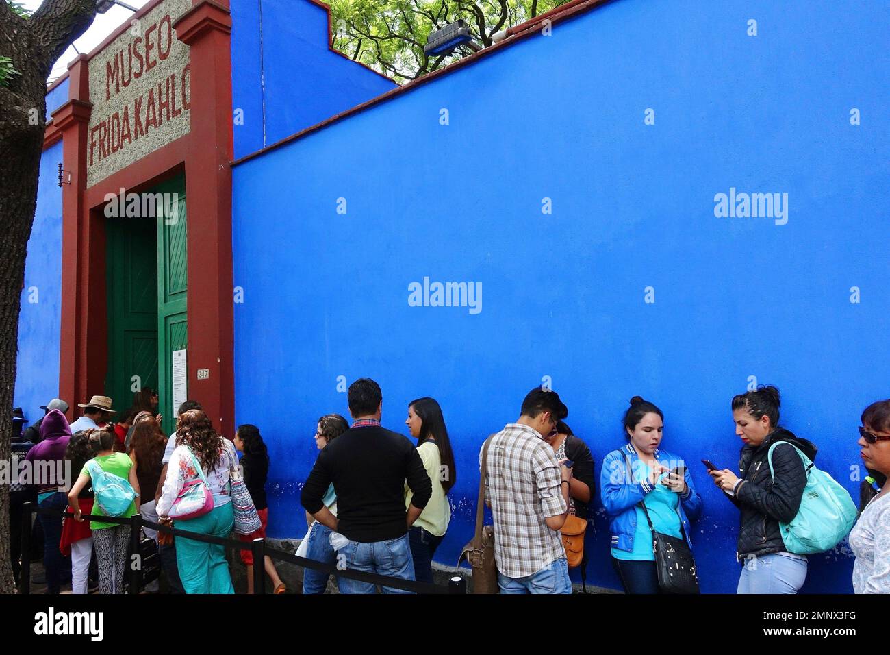 In this July 28, 2016 photo, tourists line up to enter the Museo Frida Kahlo where artists Frida ...