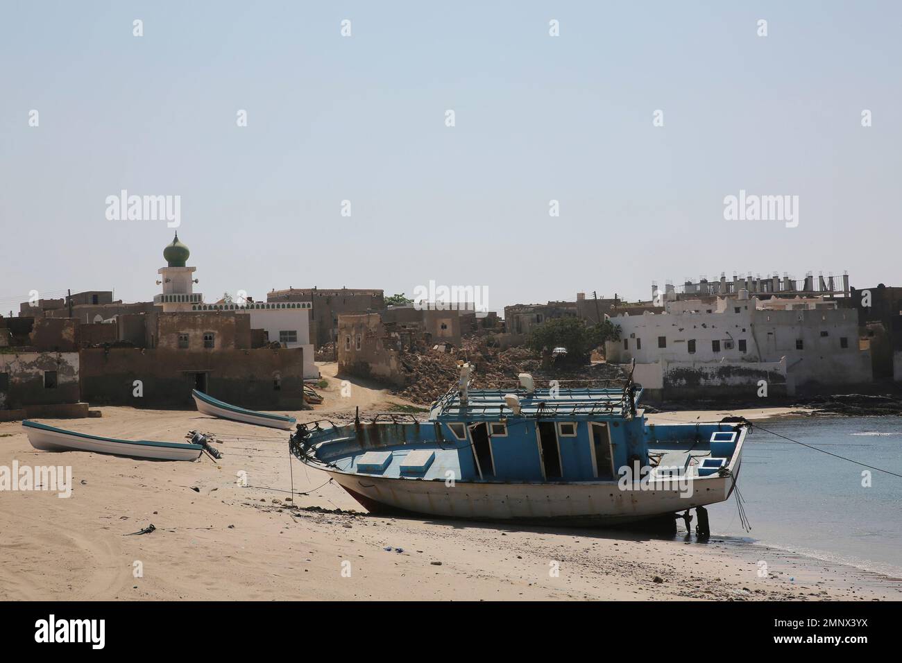 This Feb. 16, 2018 photo shows a beached fishing boat in front of a ...