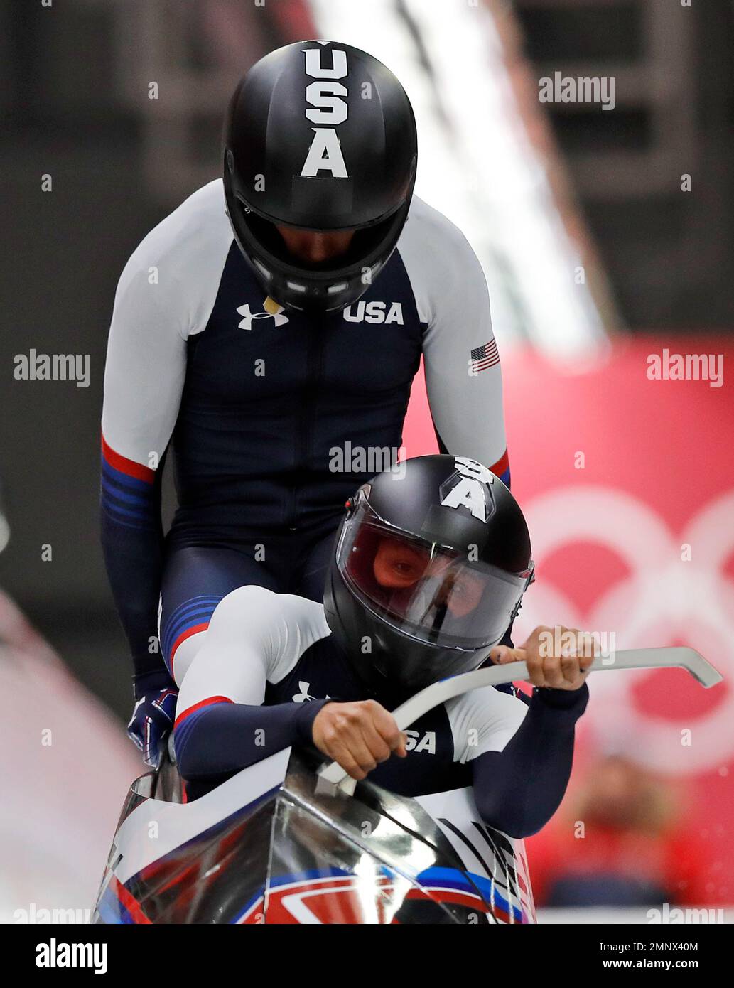 Driver Elana Meyers Taylor and Lauren Gibbs of the United States start ...