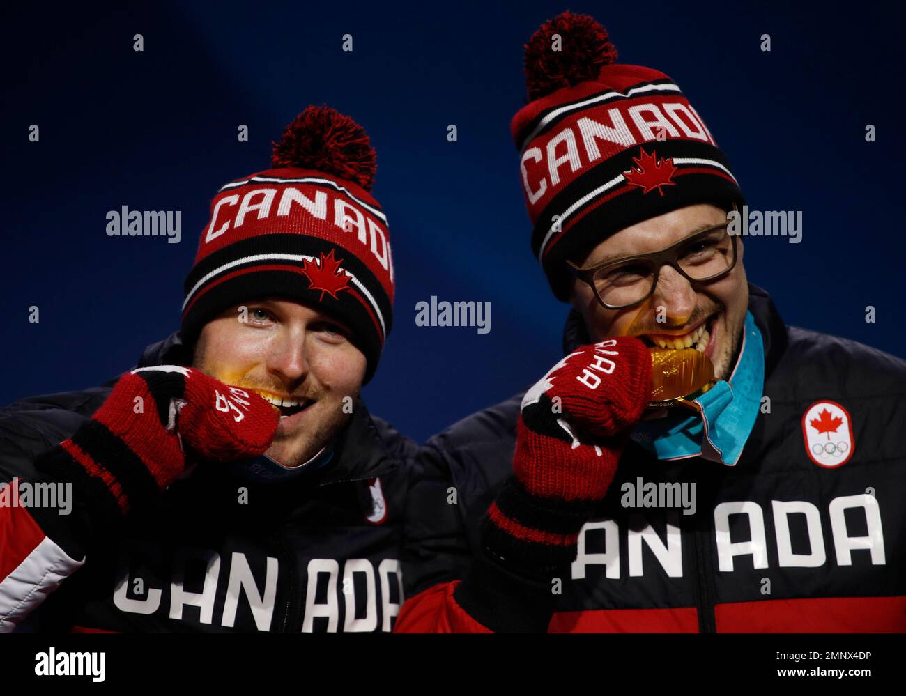 Gold medalists in the two-man bobsled from Justin Kripps, left, and ...
