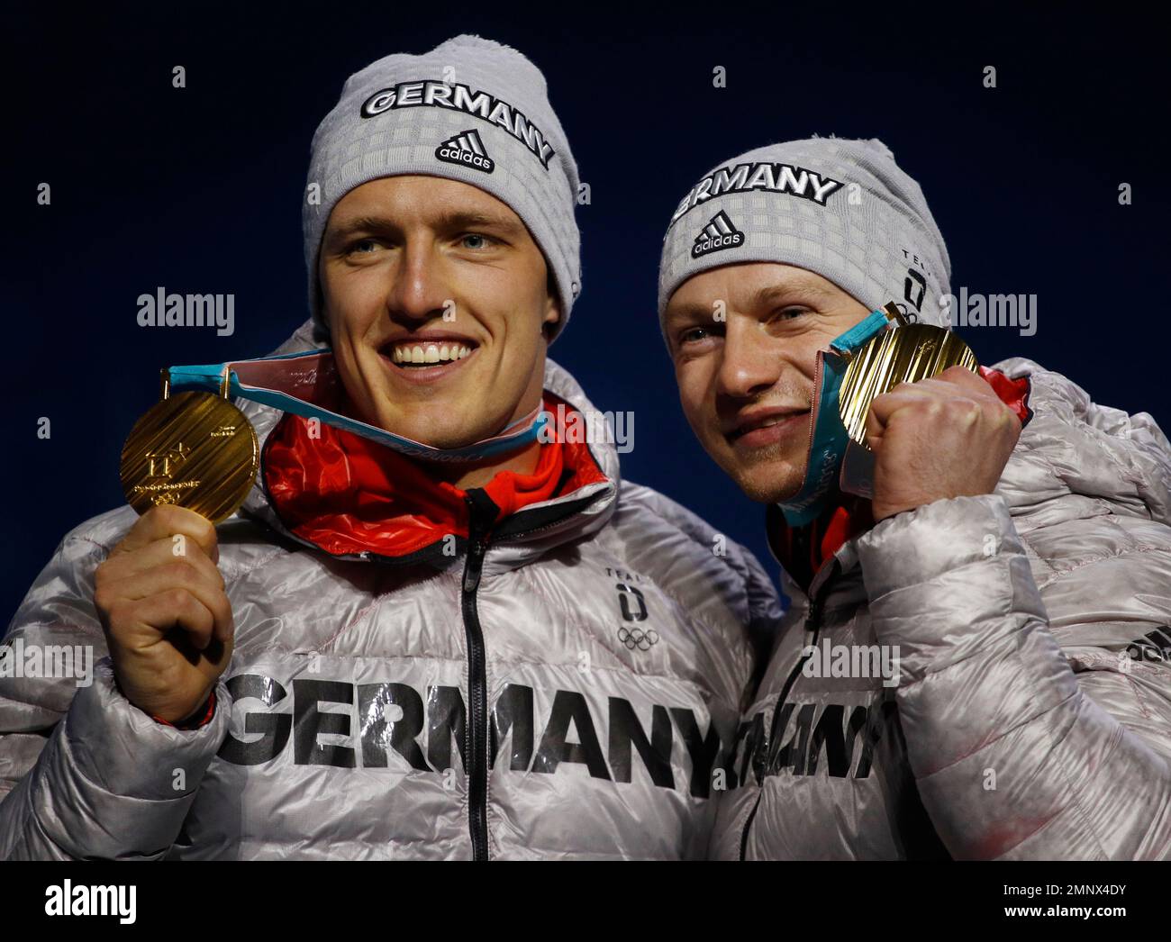 Gold medalists in the two-man bobsled Thorsten Margis, left, and ...